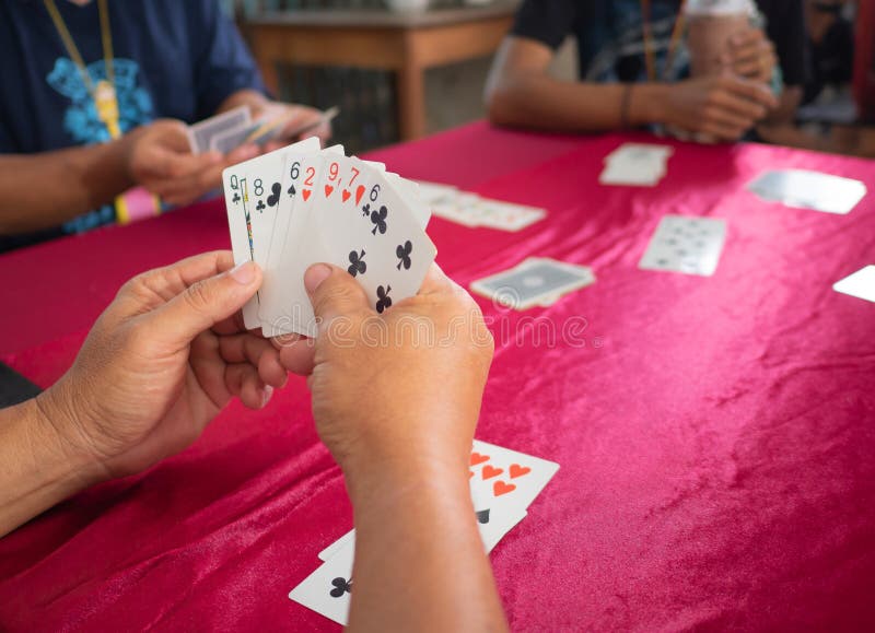 Set of Poker Cards in Hand on the Gambling Table. Stock Image - Image ...