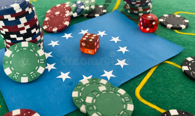 A Set of Poker Chips Stack on a Green Game Table with a Dice Rolls ...