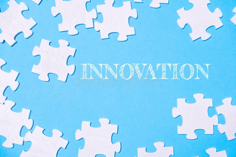 Puzzle Pieces with Innovation Text on a Blue Background Stock Image ...