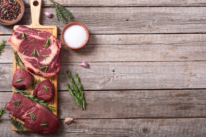 Set of raw beef steak stock image. Image of herbs, board - 197224167