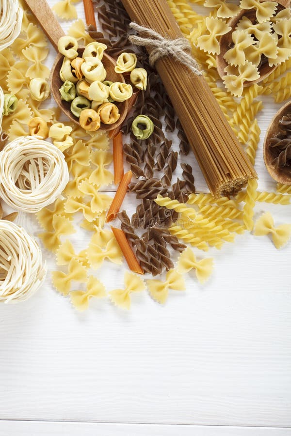 A Set of Raw Pasta on a Wooden Table Stock Photo - Image of tagliatelle ...
