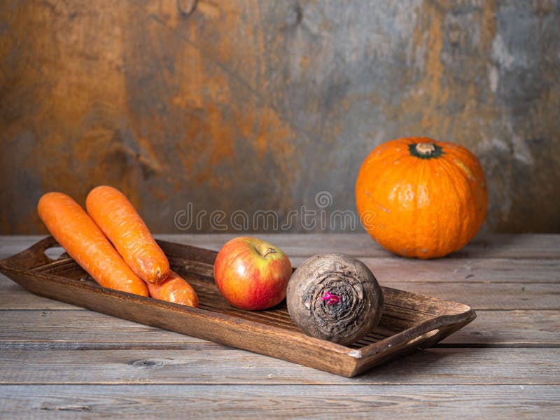 A Set of Raw Vegetables on a Long Wooden Tray on a Rustic Kitchen Table ...