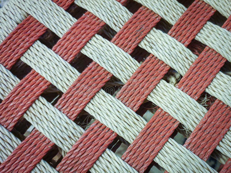A Set of Red and Grey Woven Strands Stretched between a Frame Giving an ...