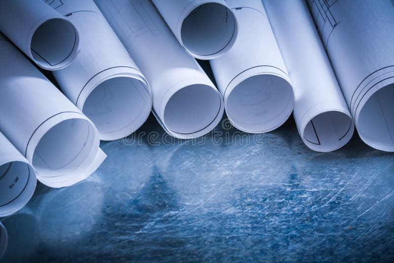 Set of Rolled Up White Construction Drawings on Stock Photo - Image of ...