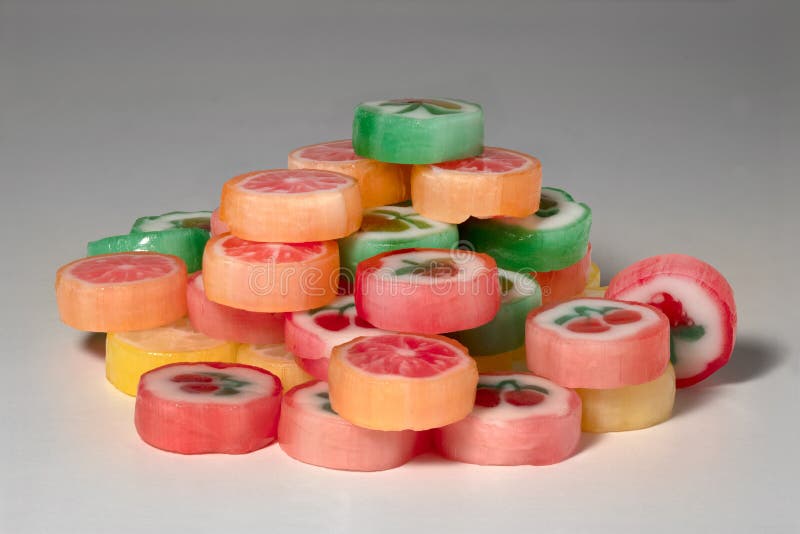 Set Of Round Fruit Caramels On A Gray Stock Image - Image of orange ...