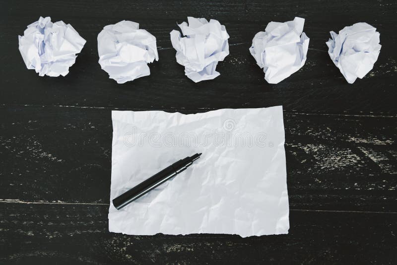 Set of Scrunched Paper Balls and Empty Torn Sheet on Dark Moody ...