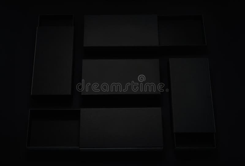 Set of Slick Black Gift Boxes on Black Background Stock Image - Image ...