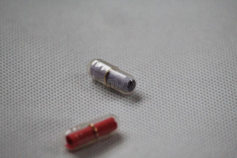 Small Notes in Capsules stock photo. Image of capsule - 141975604