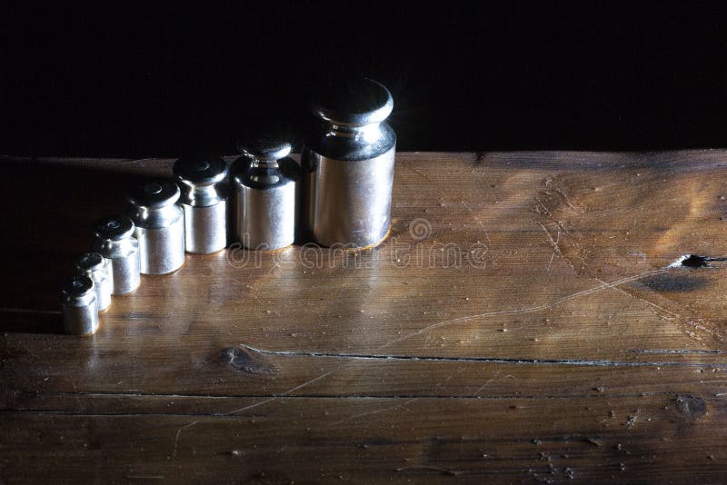 Set of Small Weights for Jewelry Scales on a Wooden Table. Front and ...
