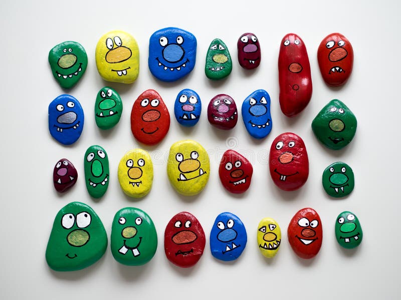 Set of Smiling Faces of Monsters. Funny Painted Acrylic Pebbles Stock ...