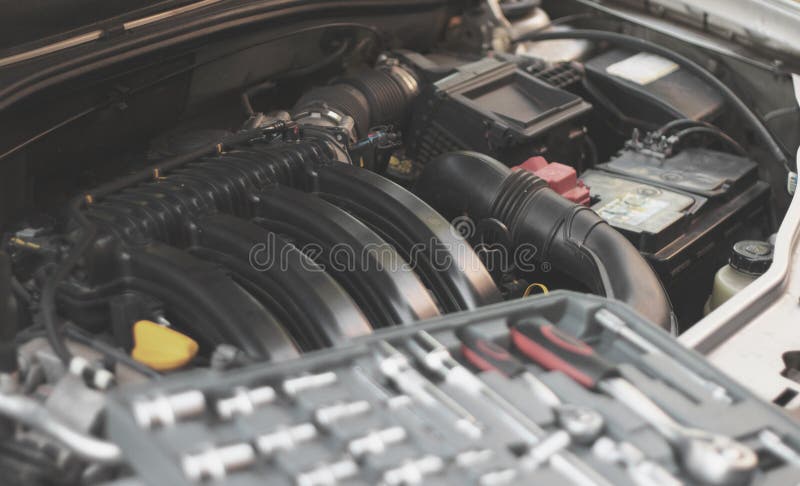 A Set of Socket Wrenches Lies on the Internal Combustion Engine of a ...