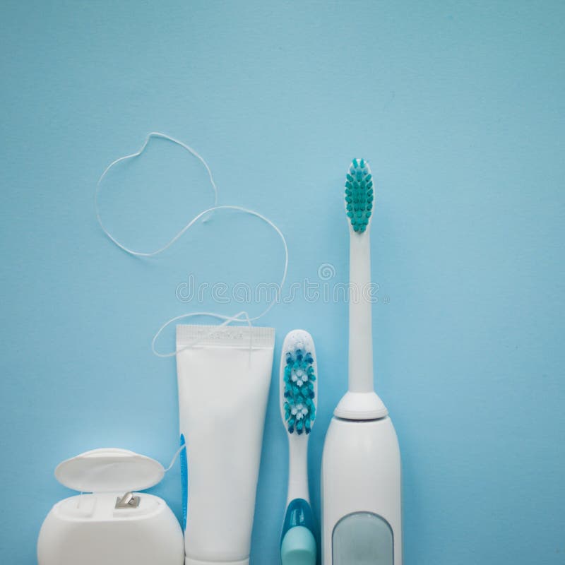 A Set of Sonic Toothbrush, Dental Floss and Toothpaste. Stock Photo ...