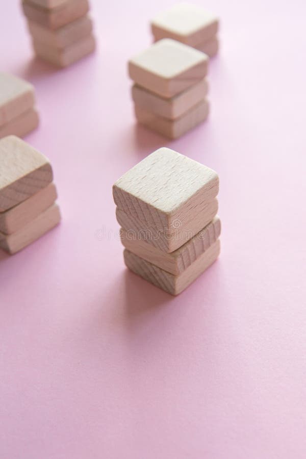 Set of Stacks of Wooden Cubes on Pink Background Stock Image - Image of ...