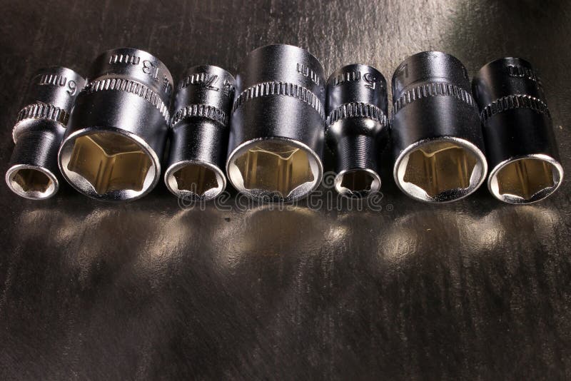 Set of Stainless Steel Hex Sockets on Shiny Metal Surface Stock Photo ...