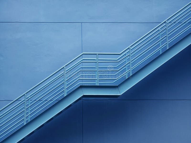 A Set of Stairs Ascending a Large Blue Wall Stock Image - Image of room ...