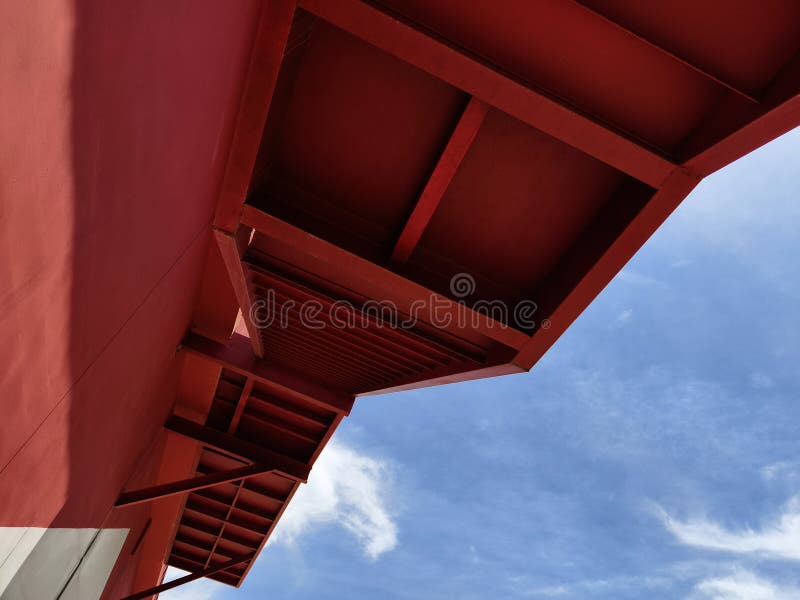 A Set of Stairs Ascending a Large Red Wall Stock Photo - Image of ...