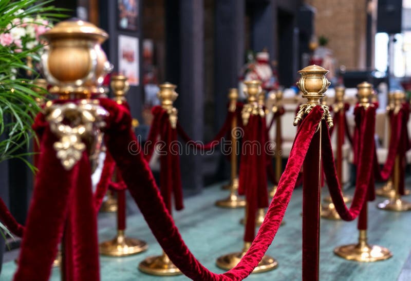 Set of Stanchions with Red Velvet Ropes Stock Photo - Image of crowd ...