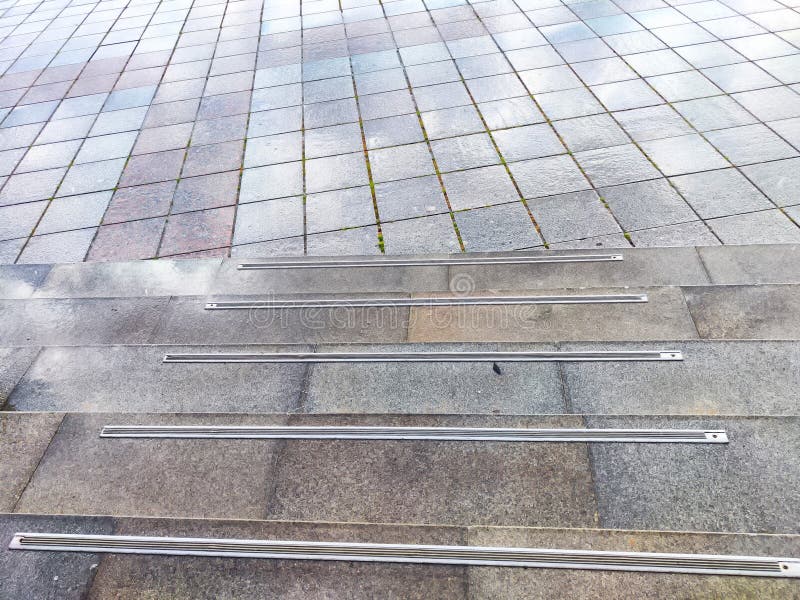 A Set of Stone Steps with Metal Grates Embedded in Each Step. the Steps ...