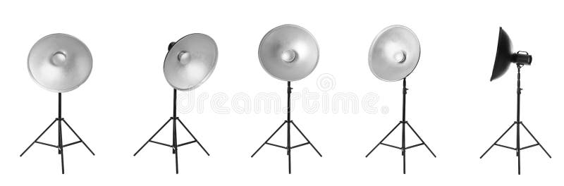 Set with Studio Flash Lights with Reflectors on Tripods Against White ...