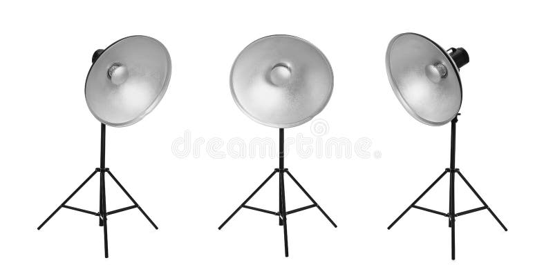 Set with Studio Flash Lights with Reflectors on Tripods Against White ...
