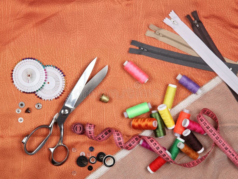 Set of Tailoring Tools and Accessories on Orange Fabric Stock Photo ...