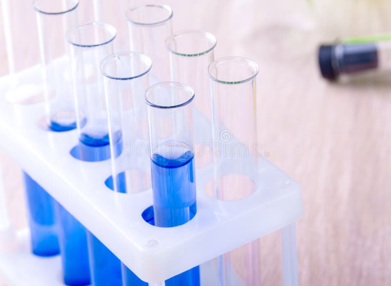 Set of Test Tubes with Blue Liquid on the Desktop. Stock Photo - Image ...