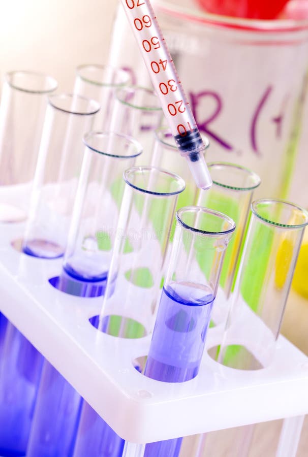 Set of Test Tubes with Blue Liquid on the Desktop. Stock Photo - Image ...