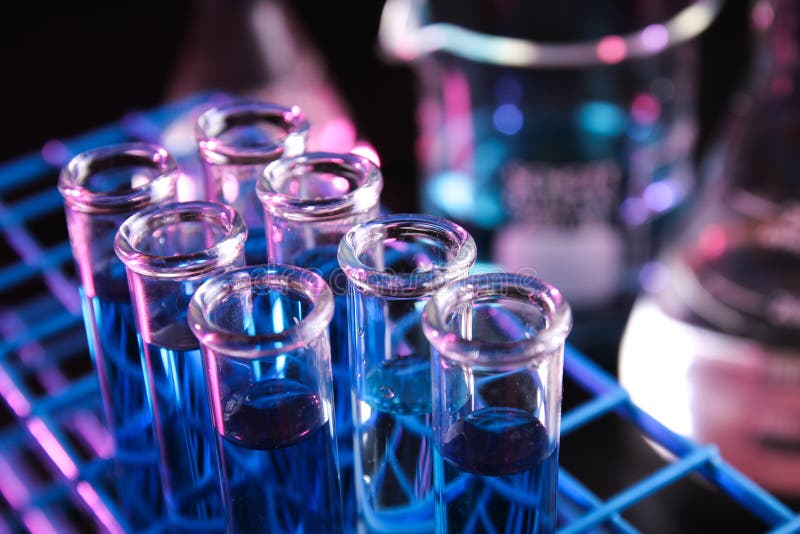 Set of Test Tubes Filled with Blue Chemical in Dark Lab Set Up Stock ...