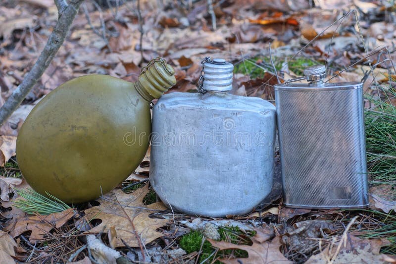 A Set of Three Old Army Flasks Stand on the Ground Stock Photo - Image ...