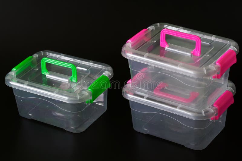 A Set of Three Transparent Plastic Containers with Multi-colored Lids ...