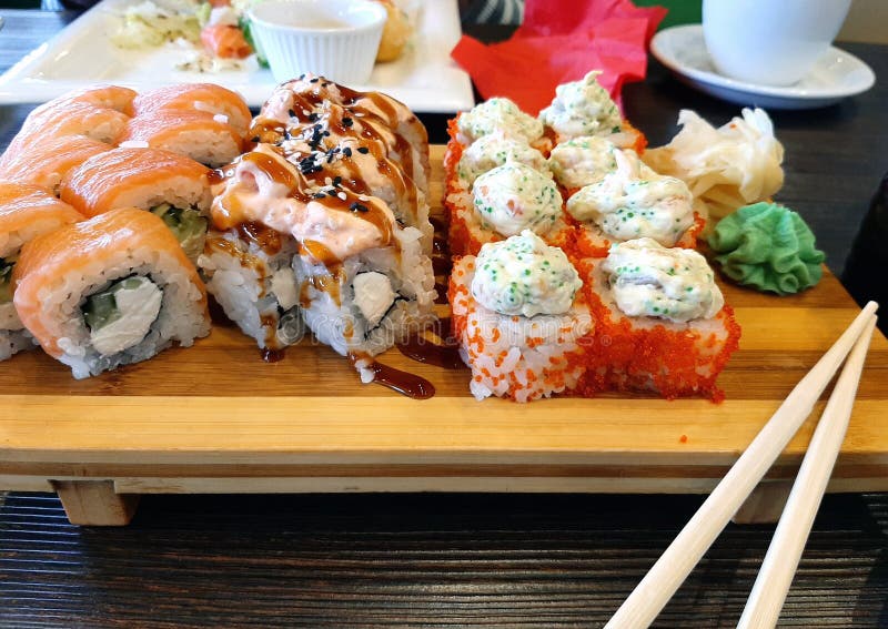 A Set of Three Types of Sushi on a Board in a Japanese Restaurant Stock ...