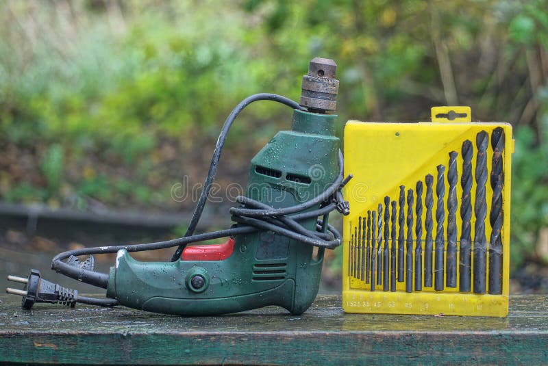 A Set of Tools from a Green Electric Drill Stock Photo - Image of metal ...