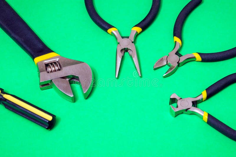 Set of Tools for Master Plumber or Electrician on Green Background ...