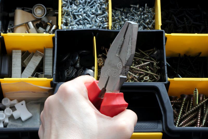 A Set of Tools in a Plastic Box, Pliers in a Hand. Stock Image - Image ...