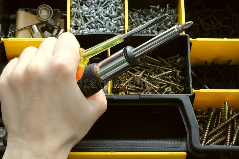 A Set of Tools in a Plastic Box, a Screwdriver in His Hand. Stock Image ...
