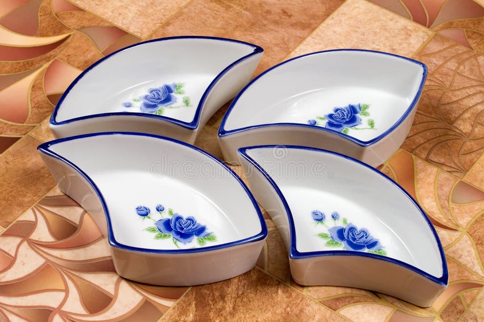 A Set of Triangular Dishes with a Blue Floral Pattern. Stock Image ...