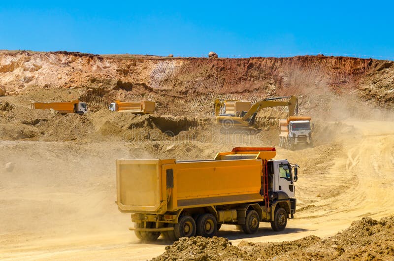 Trucks and the Excavator Work in Career at Mining Stock Photo - Image ...