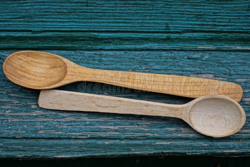 A Set of Two Rustic Old Brown Spoons Stock Photo - Image of board ...
