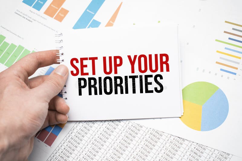 Set Up Your Priorities on a Notepad and Financial Documents and a Cup ...