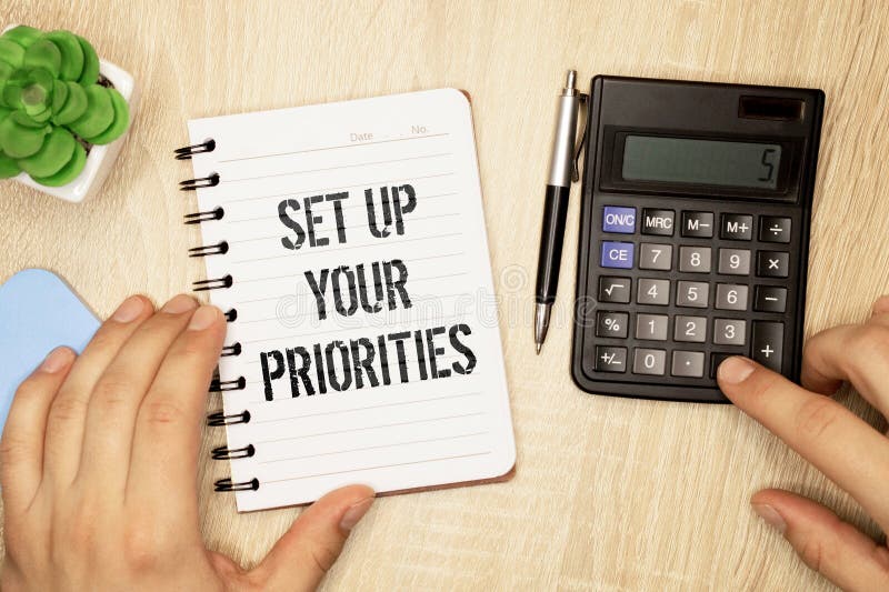 Set Up Your Priorities Sign on Notepad on the White Backgound Stock ...