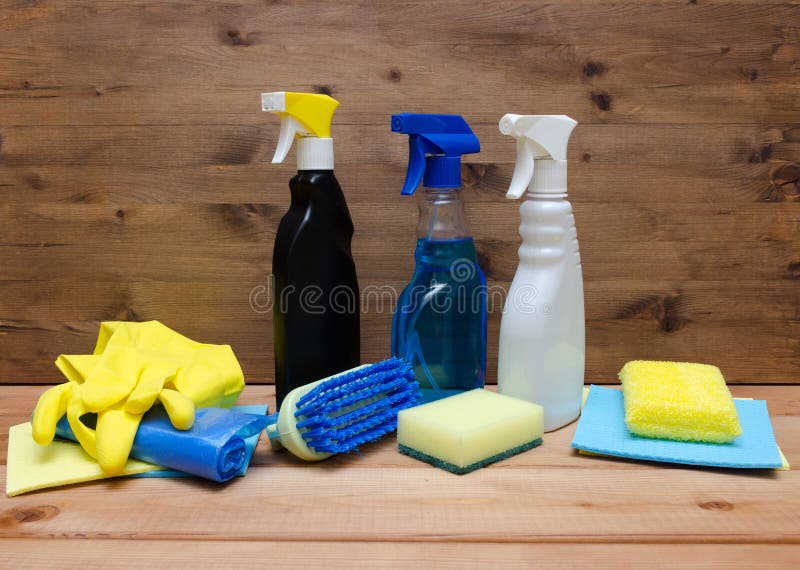 Set of Variety Cleaning Supplies on Wooden Table Stock Image - Image of ...