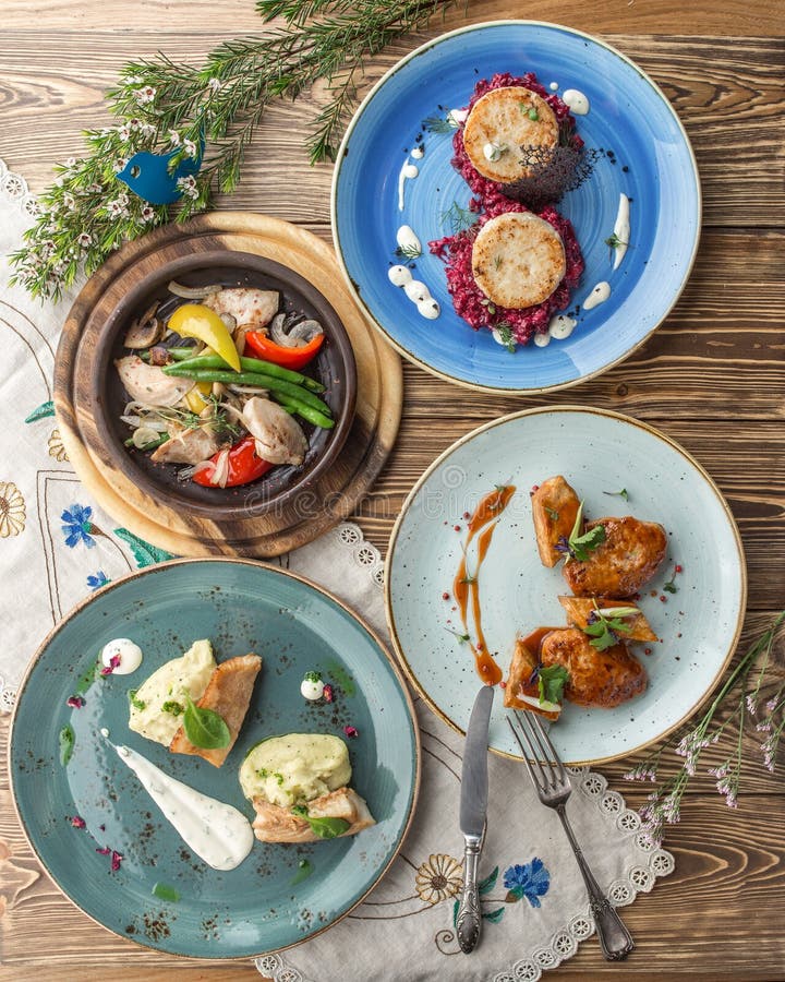 Set of Various Chicken and Fish Dishes Main Course on Wooden Table ...