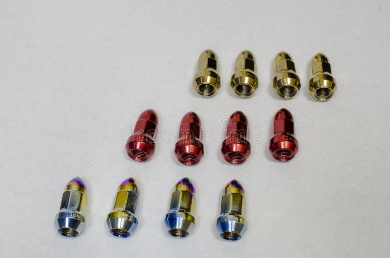 Set of Wheel Nuts of the Car of Different Color Stock Image - Image of ...