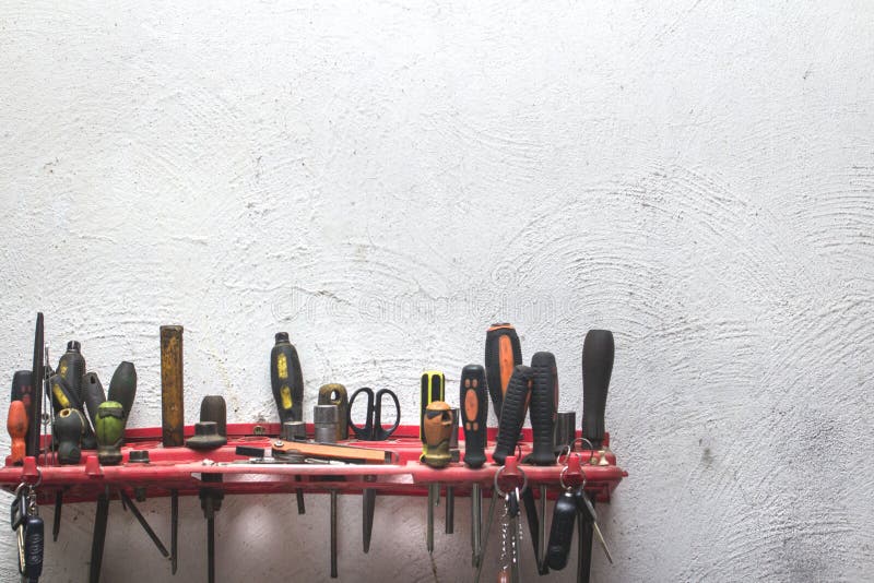 A Set of Working Construction Tools on a White Plastered Wall Stock ...