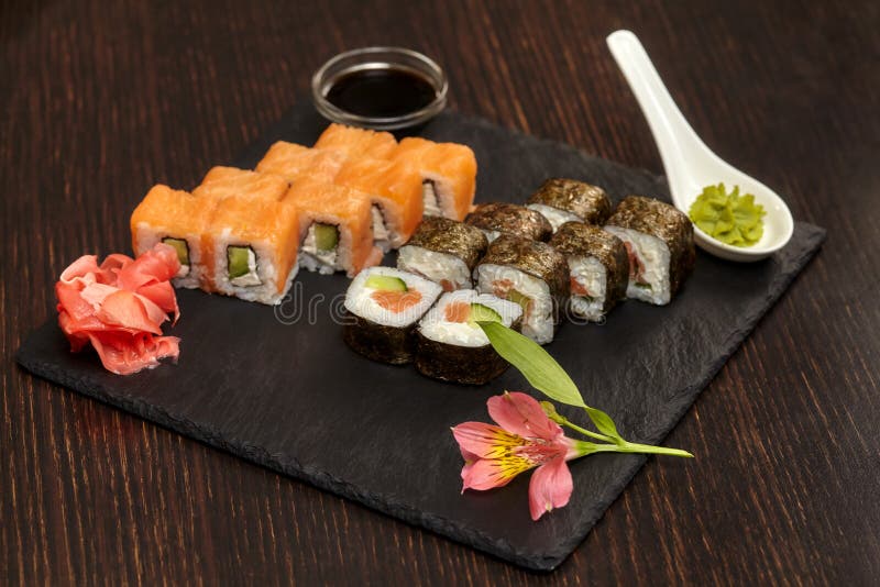 Sets of Sushi Rolls on Black Slate Plate Stock Image - Image of black ...