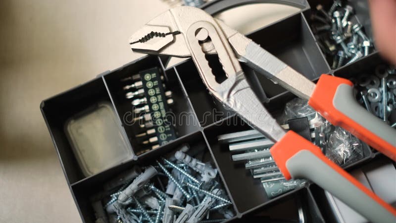 Sets of Tools and the Hands of the Master Who is Engaged in Repair ...