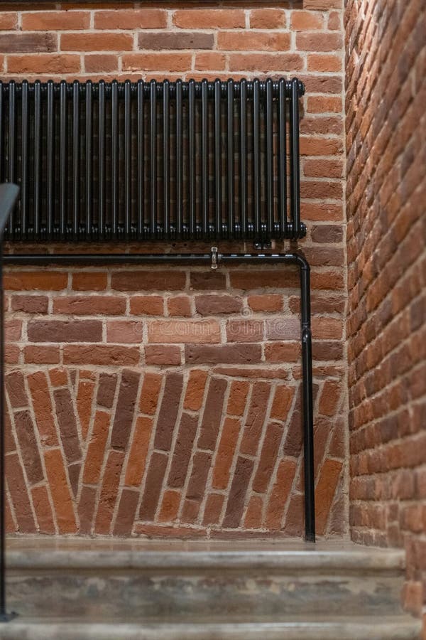 Warm and Cozy Radiator Against a Brick Wall in St. Petersburg Stock ...