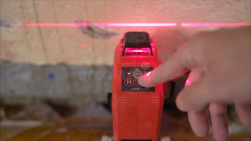 A Laser Level Machine during Measurement Work in a Dark Setting ...