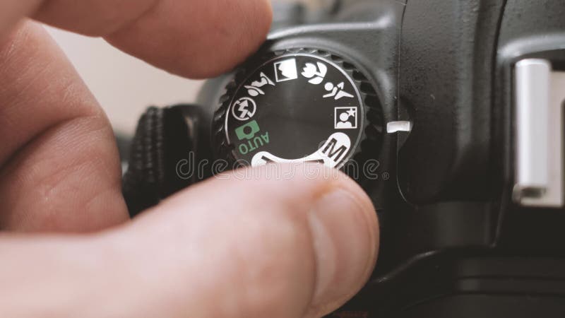Setting Mode Dial Lock Button of the Camera Reflex - Macro. Fingers ...