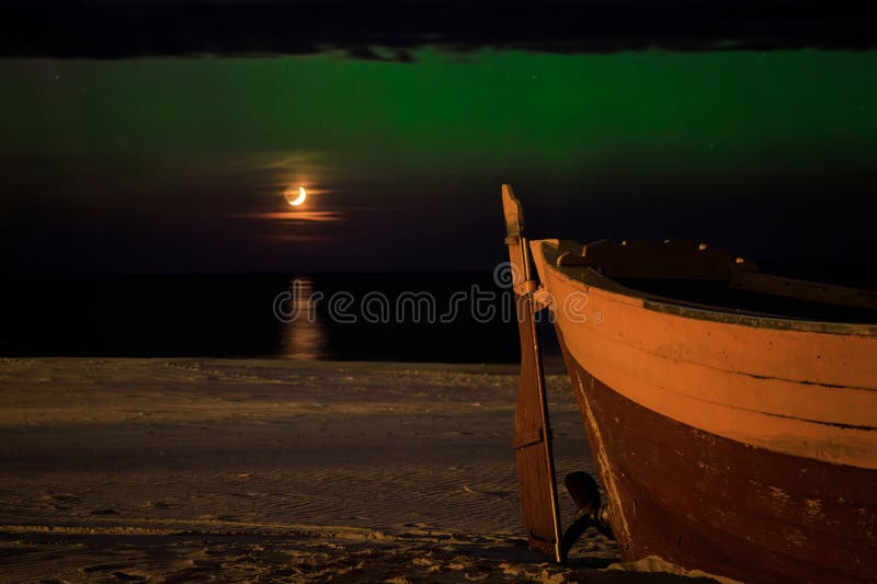 The Setting Moon Over the Baltic Sea and the Green Aurora in Poland ...